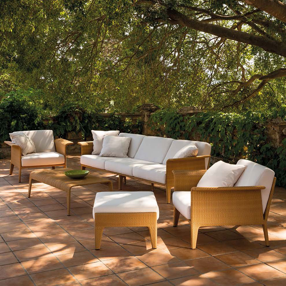 Loom Crafts Outdoor Garden Furniture A white sofa set on a tiled patio ...